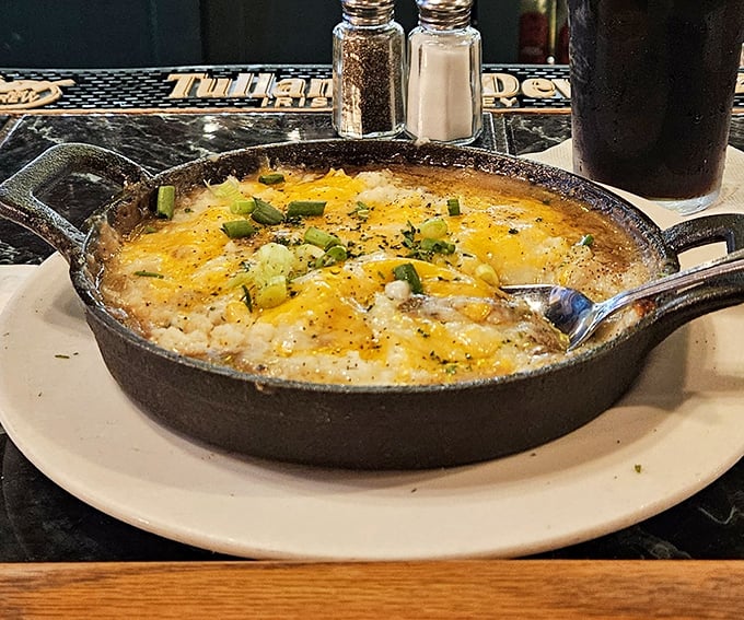 Bubbling cheese atop a skillet of comfort – this isn't just food, it's a warm hug after a long day in edible form.
