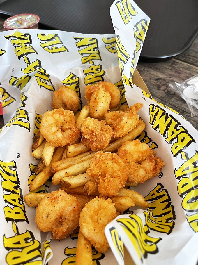 Golden-fried shrimp nestled among crispy fries – the kind of basket that makes you wonder why you ever eat anything else.