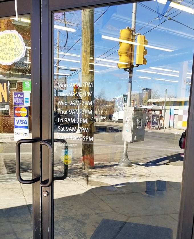 The store hours posted clearly on the door—because treasure hunting requires proper planning and timing.