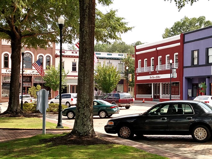 Colorful storefronts frame Abbeville's square like a painter's palette. Each building tells a story—no cookie-cutter chain stores in this visual feast.