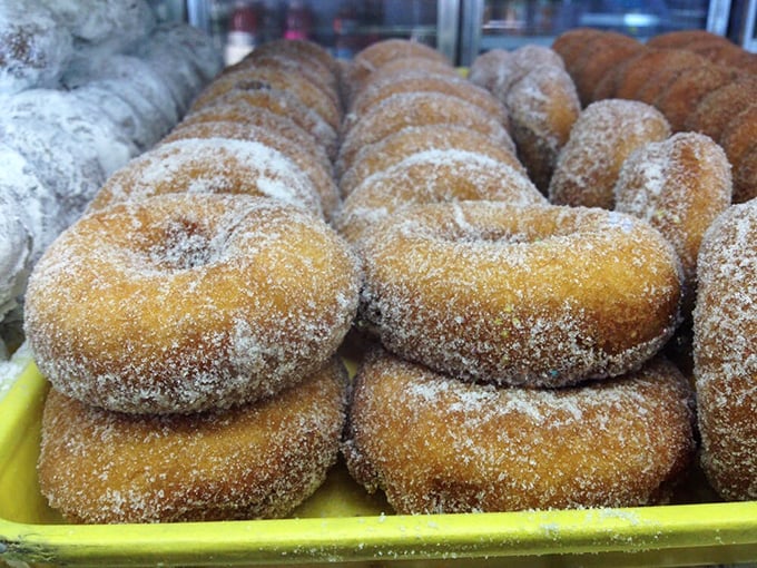Sugar-dusted donuts stacked with military precision, ready to deploy their sweet assault on willpower across Centerville and beyond.