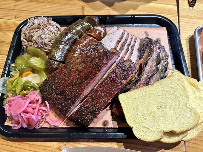 A barbecue tray that would make a Texan tip their hat – perfectly barked brisket, sausage, and pickled vegetables for that essential acid balance.
