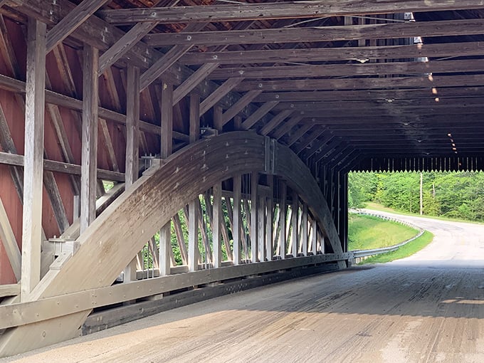 The elegant timber arch isn't just beautiful—it's engineering genius disguised as rustic simplicity, supporting travelers for generations.
