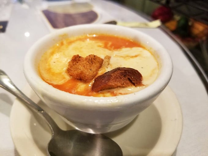 This tomato soup isn't playing around. Rich, velvety, and topped with a golden island of melting cheese—comfort food that hugs you from the inside.