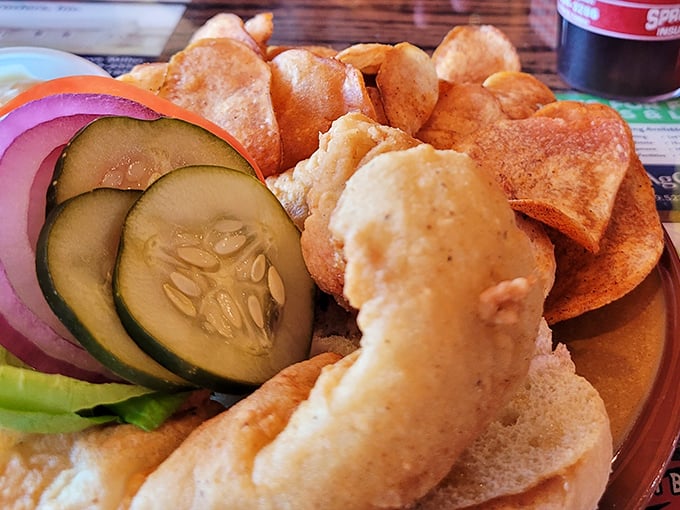 A sandwich that demands to be eaten with both hands and plenty of napkins nearby. Those homestyle chips aren't just sides—they're essential supporting actors.