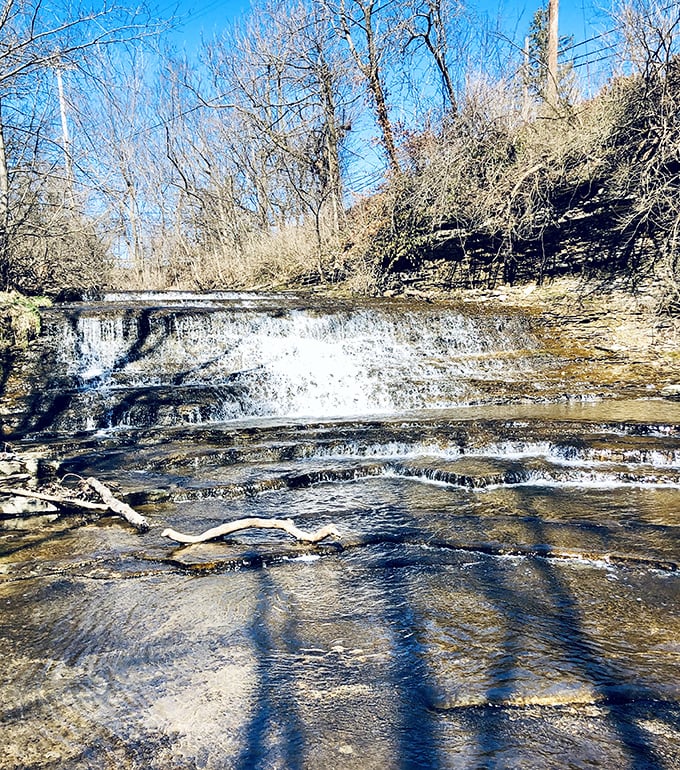 Natural cascades create nature's soundtrack just minutes from downtown. These limestone steps have been smoothed by centuries of flowing water.
