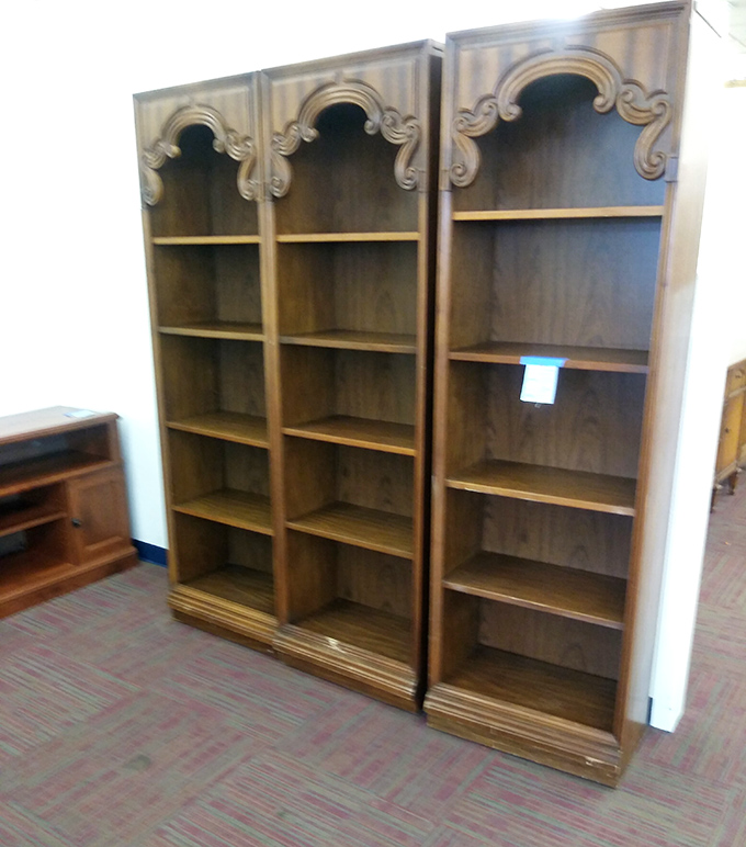 These ornate wooden bookshelves aren't just furniture—they're waiting libraries ready to showcase your impressive collection of unread books.