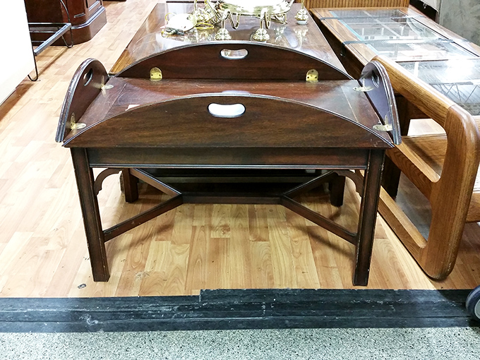 Butler's tray tables like this wooden beauty don't just serve drinks—they serve up a slice of elegance from another era.