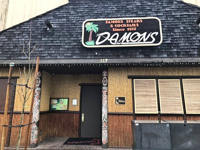 Damon's tiki-inspired entrance promises a tropical steakhouse adventure – like your steak took a vacation to Hawaii.