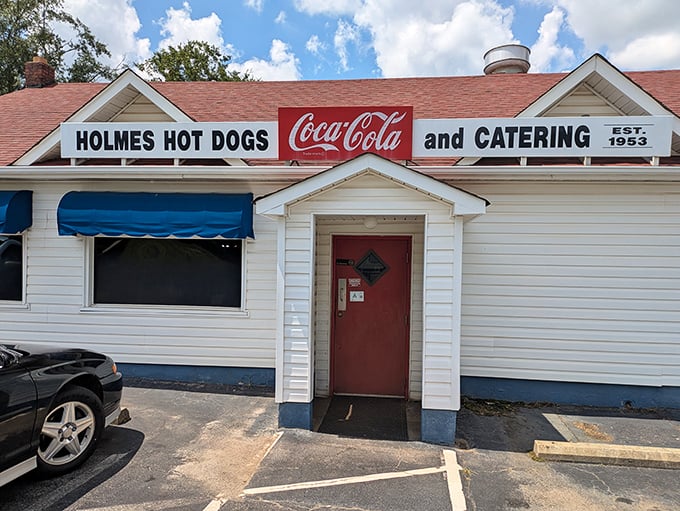 This pristine white building with Coca-Cola signage screams "authentic American diner experience" from every angle.