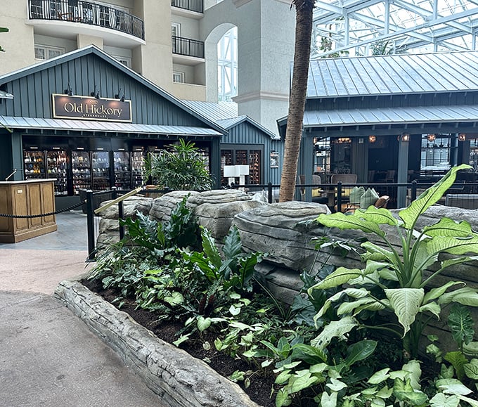 Old Hickory looks like a luxury cabin that somehow landed in a tropical atrium. Those stone planters aren't decoration—they're to keep you from floating away in beef ecstasy.