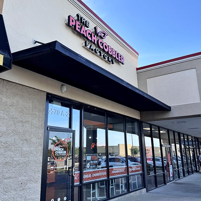 The Peach Cobbler Factory's storefront showcases their diverse menu beyond just cobbler. A dessert wonderland awaits the brave!
