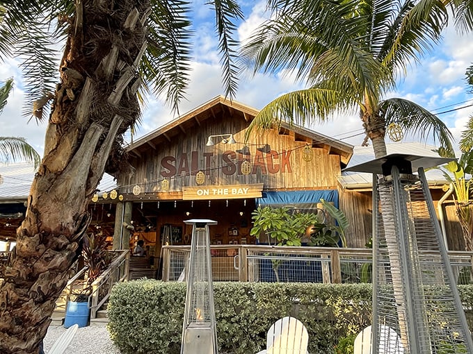 Salt Shack's rustic wooden exterior and thatched roof create the perfect backdrop for sunset seafood feasts.