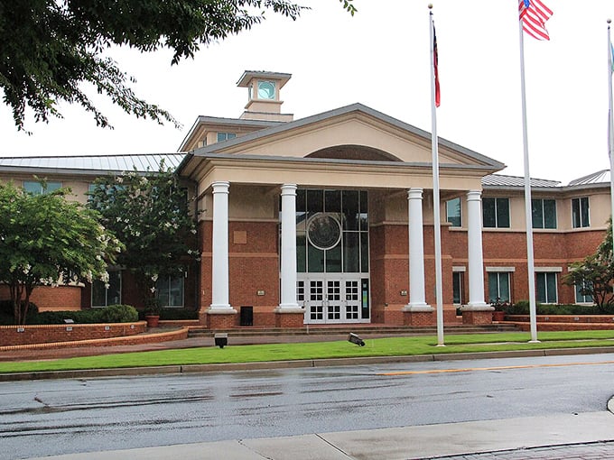 Smyrna's City Hall stands ready for business, rain or shine! Where modern brick meets classical columns in a government building that means business.