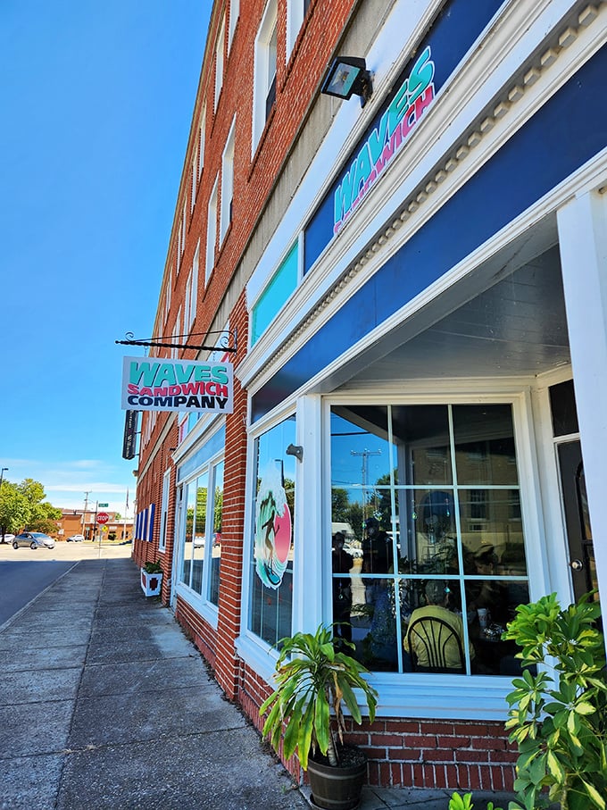 Waves Sandwich Company brings beach vibes to downtown with its bright blue sign. Surfboards and sandwiches – an unexpected perfect pairing.
