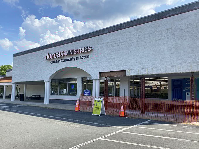 The simple white exterior of Dorcas Thrift Shop is like a blank canvas – inside is where the colorful bargains begin!