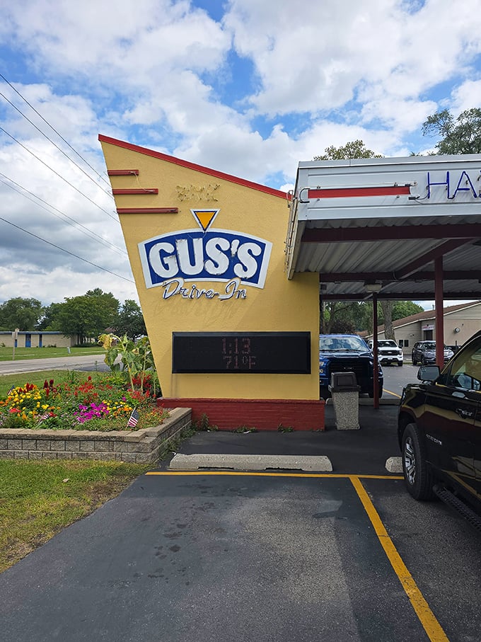 Gus's Drive-In's distinctive yellow fin sign—part architectural statement, part invitation to the best custard in East Troy.
