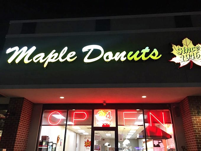 That glowing sign cuts through the darkness like a sweet beacon for late-night cravings.