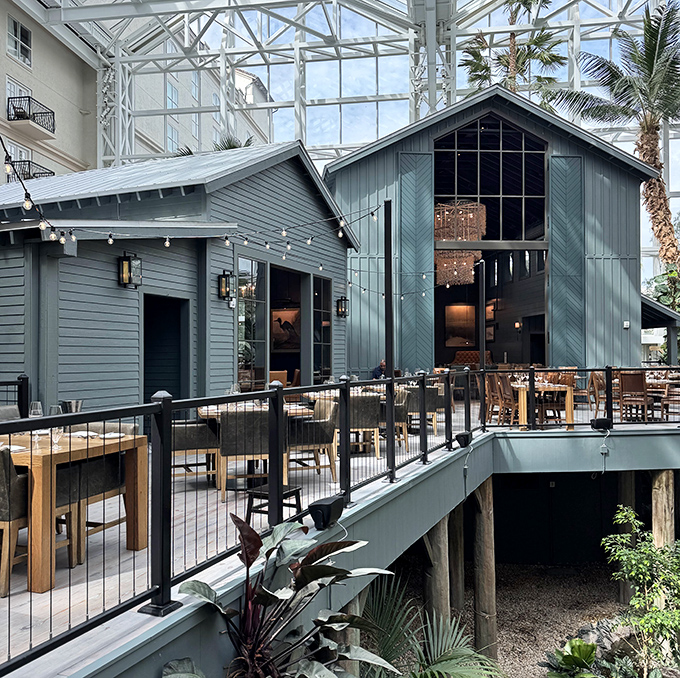 The blue-gray barn aesthetic isn't just for show—it's architectural foreshadowing for the rustic flavors waiting inside Old Hickory's elegant interior.