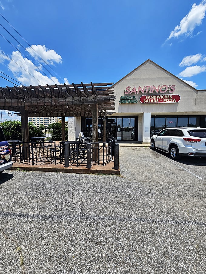 The pergola-covered patio offers the perfect setting to contemplate life's important questions, like "Should I order another pizza?"