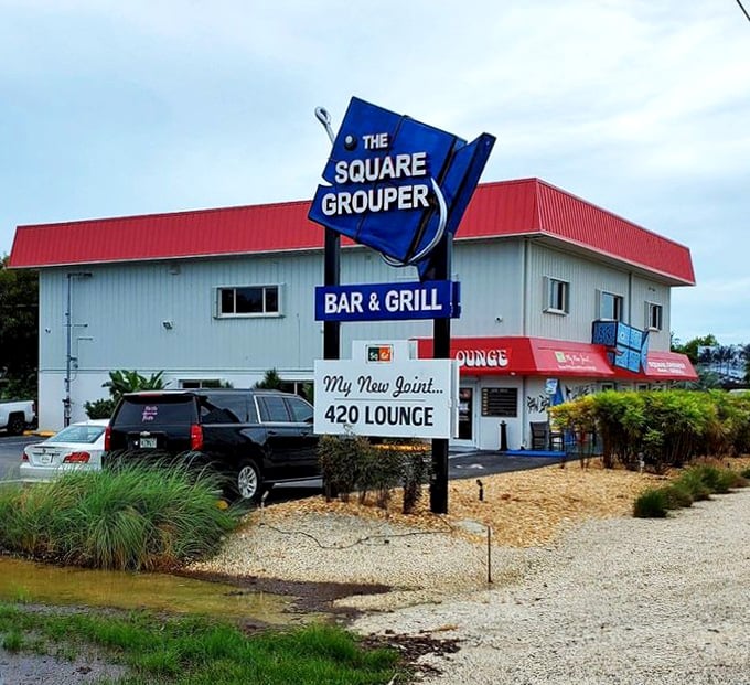 That fishing hook sign tells you everything you need to know—this Cudjoe Key spot takes its grouper seriously. The 420 Lounge next door? That's just a bonus!
