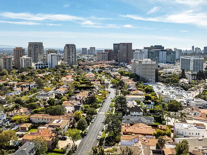 Tree-lined residential streets create a perfect patchwork of suburban life beneath those impressive high-rise buildings.