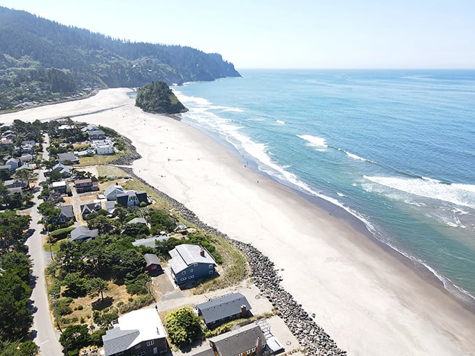 From above, Neskowin reveals its perfect geometry—a village nestled precisely where forest, river, and ocean converge in coastal harmony.