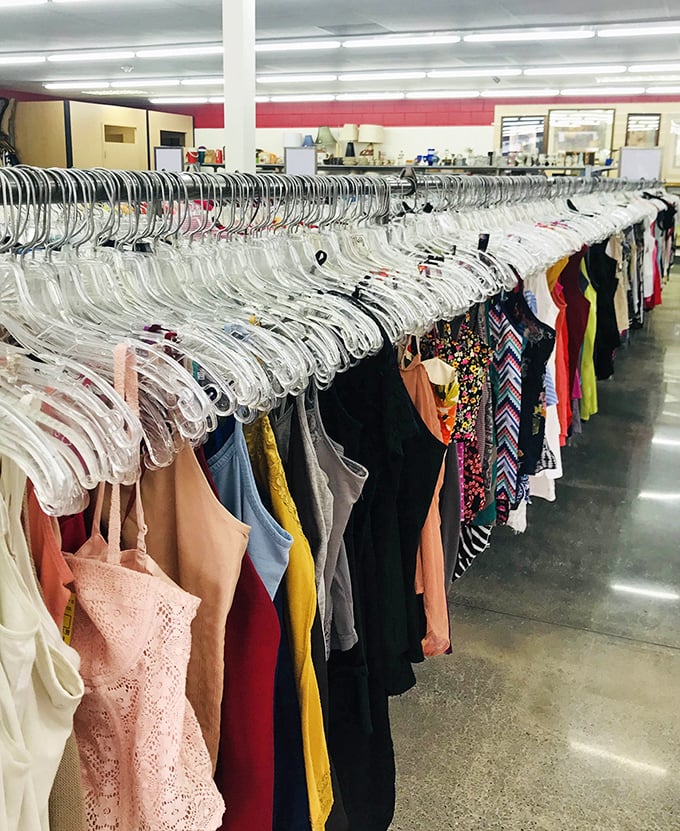 Clear plastic hangers create a uniform army of possibilities, each garment patiently waiting for its "you had me at hello" moment.