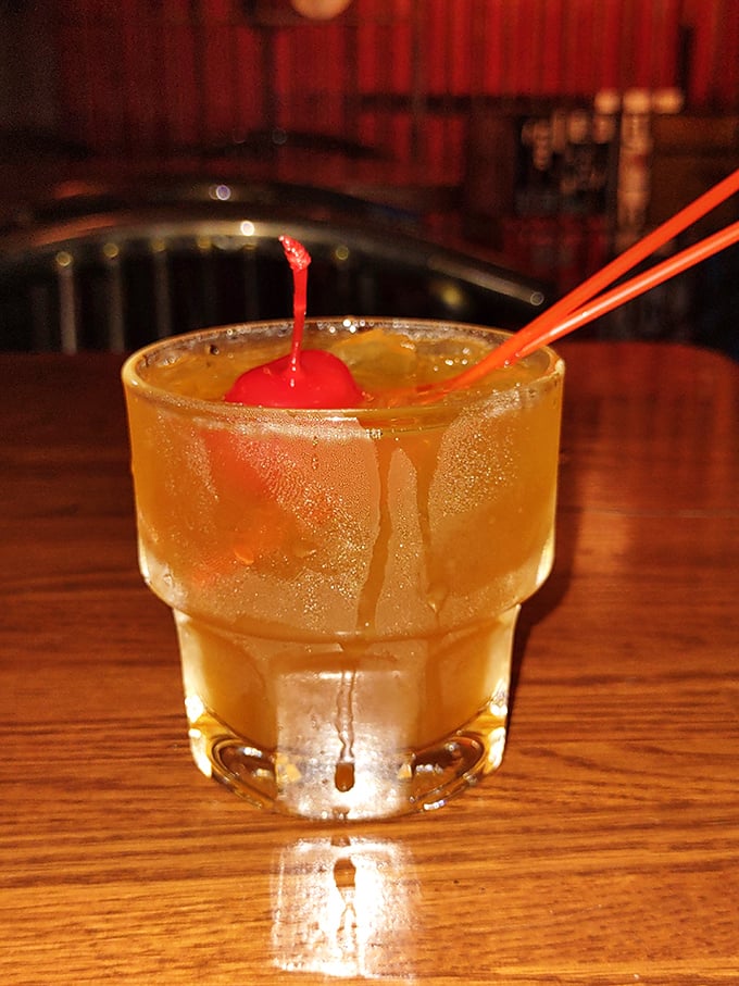 An Amaretto Sour that's both nostalgic and perfectly executed – the maraschino cherry isn't just garnish, it's the exclamation point on a liquid poem.