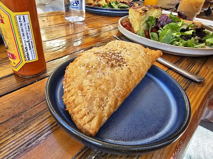 This isn't just an empanada—it's a handheld treasure chest of flavor that makes you wonder why you ever settled for toast.