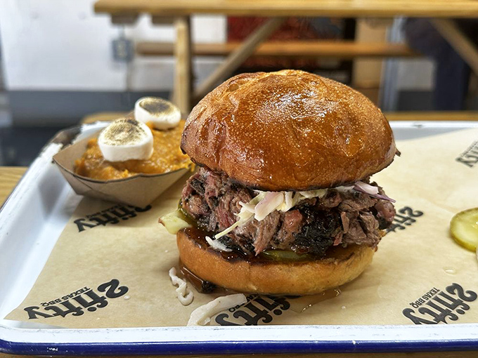 Not just a sandwich but an architectural marvel of smoke and spice, where bread serves merely as a delivery system for barbecue brilliance.