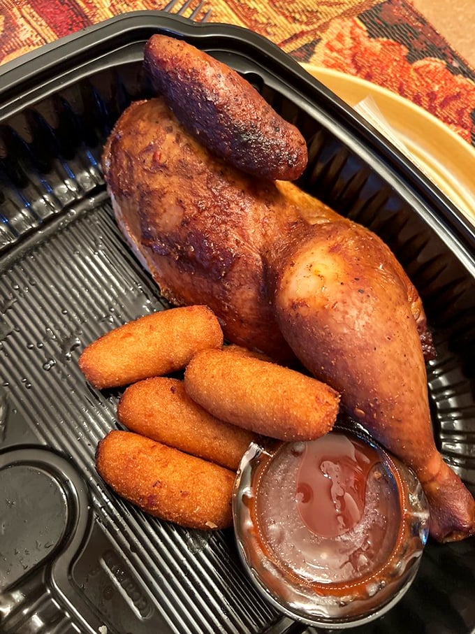 Smoky chicken with a mahogany exterior and those same golden hush puppies. A barbecue duet that sings in perfect harmony.