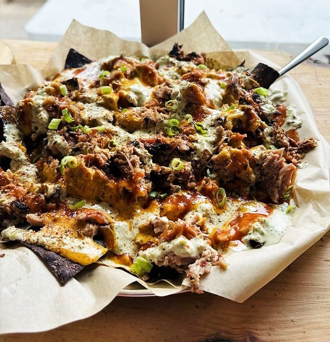 BBQ nachos that solve the eternal problem of "too many naked chips at the bottom." Every bite delivers the full experience.
