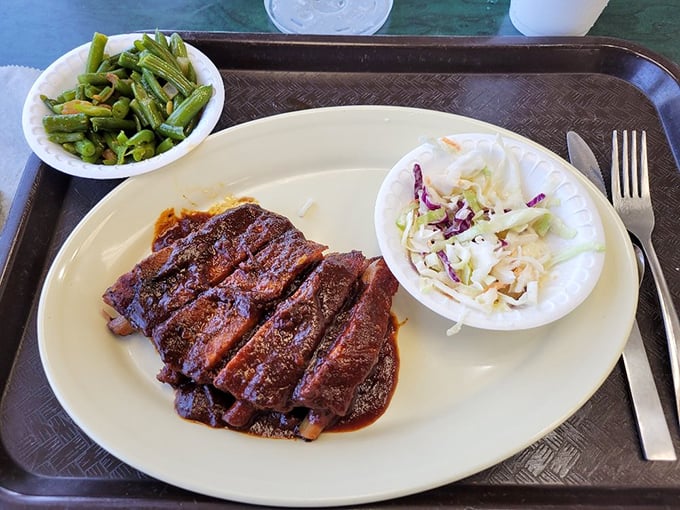 Brisket sliced thick with just enough sauce to complement, not hide. Those sides aren't afterthoughts—they're supporting actors in a meaty drama.