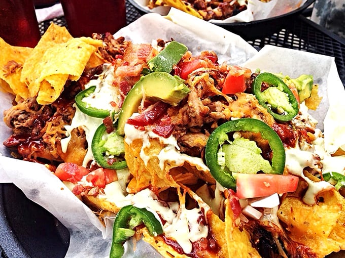 BBQ nachos that break all the rules. Crispy chips buried under an avalanche of meat, jalapeños, and creamy toppings – fork required, restraint impossible.