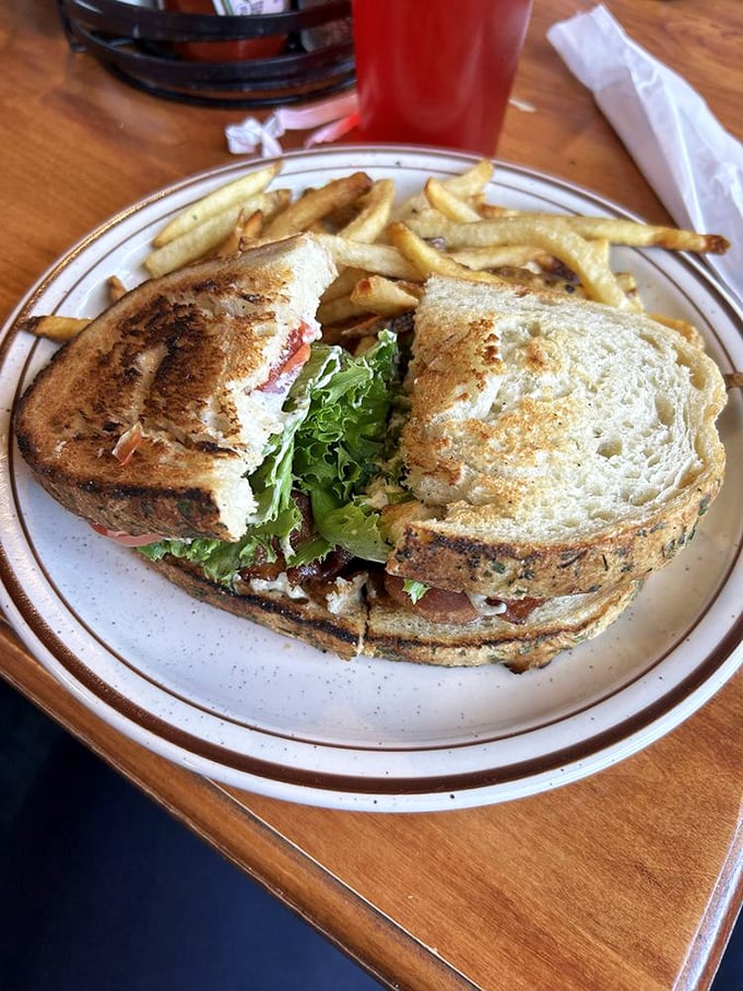 A classic BLT elevated to art form—crisp lettuce, juicy tomato, and bacon that's achieved that mythical balance between chewy and crisp.
