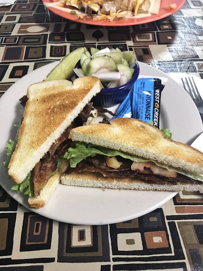 A perfectly executed BLT with cucumber salad on the side—proof that simple classics, when done right, need no reinvention.