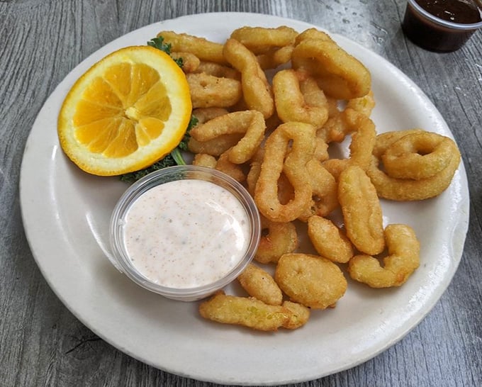 Golden-fried calamari that's crispy, tender, and served with a dipping sauce worth bottling and taking home.