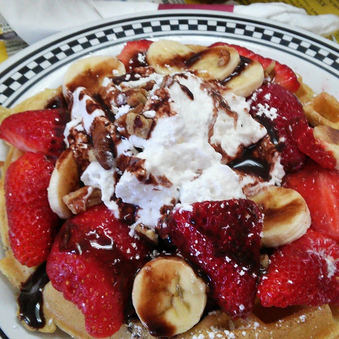 Waffles living their best life, adorned with fresh strawberries and bananas. Breakfast masquerading as dessert – the ultimate morning hustle.