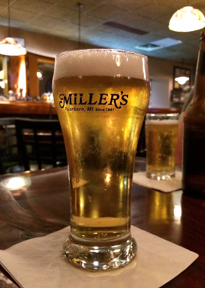 A cold beer in a Miller's glass – because sometimes the universe just hands you these perfect little moments of symmetry.