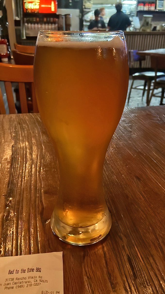 A golden pilsner standing tall like a trophy for surviving the workweek. The perfect companion to wash down smoky delights.