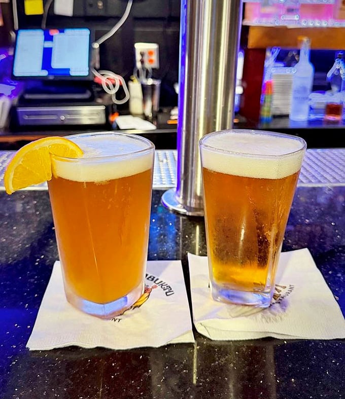 Cold beer and good company—the perfect supporting cast for the star of the show. That orange slice isn't just garnish, it's optimism in citrus form.
