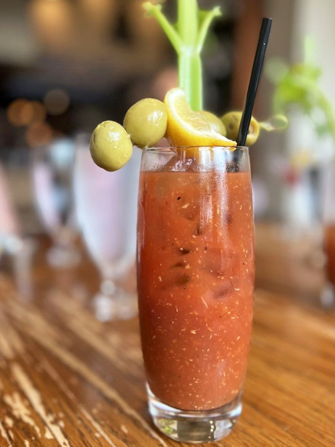 Not just a Bloody Mary—it's breakfast, entertainment, and a hangover cure wearing olives like a jaunty hat.