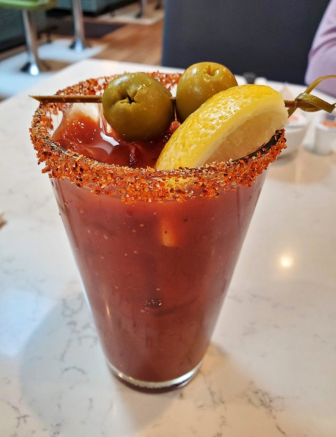 A Bloody Mary that's practically a meal unto itself. That spicy rim isn't playing games – it means business, delicious business.