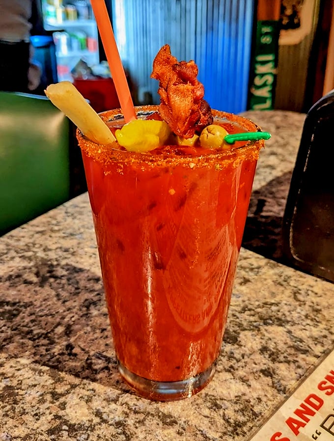 A Bloody Mary that's practically a meal, garnished with what appears to be bacon. Sunday brunch's best friend or Tuesday night's bold decision.