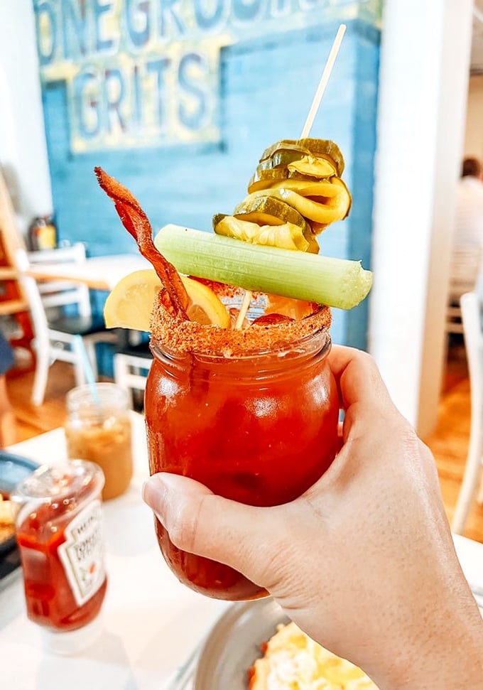 A Bloody Mary that doubles as a small appetizer. That bacon strip isn't garnish—it's an exclamation point.
