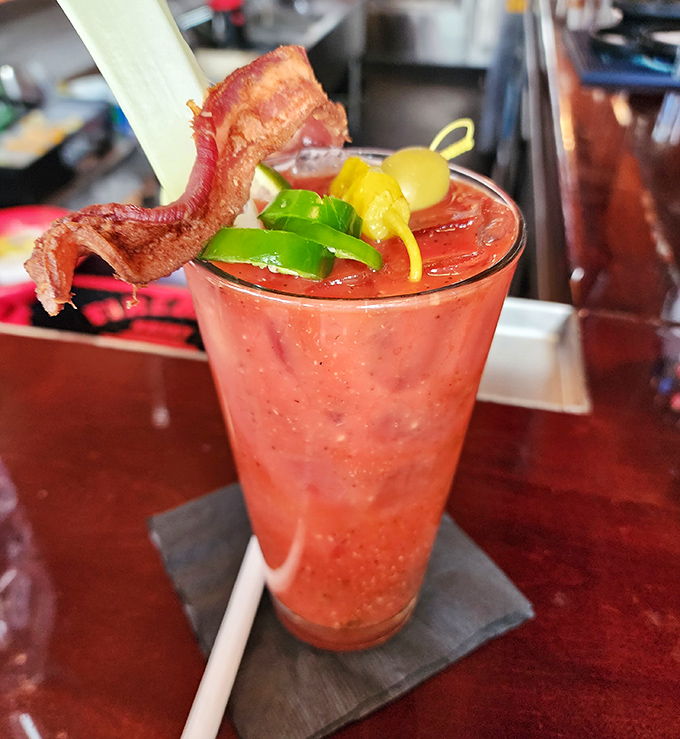 This Bloody Mary isn't just a drink, it's a meal with a straw. That bacon garnish isn't playing around—it means business.