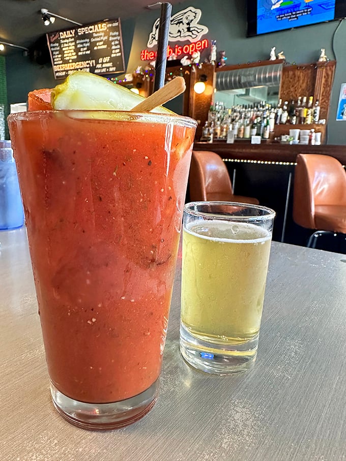 The Bloody Mary arrives like a meal in itself, accompanied by what appears to be a beer chaser—the Milwaukee handshake in liquid form.
