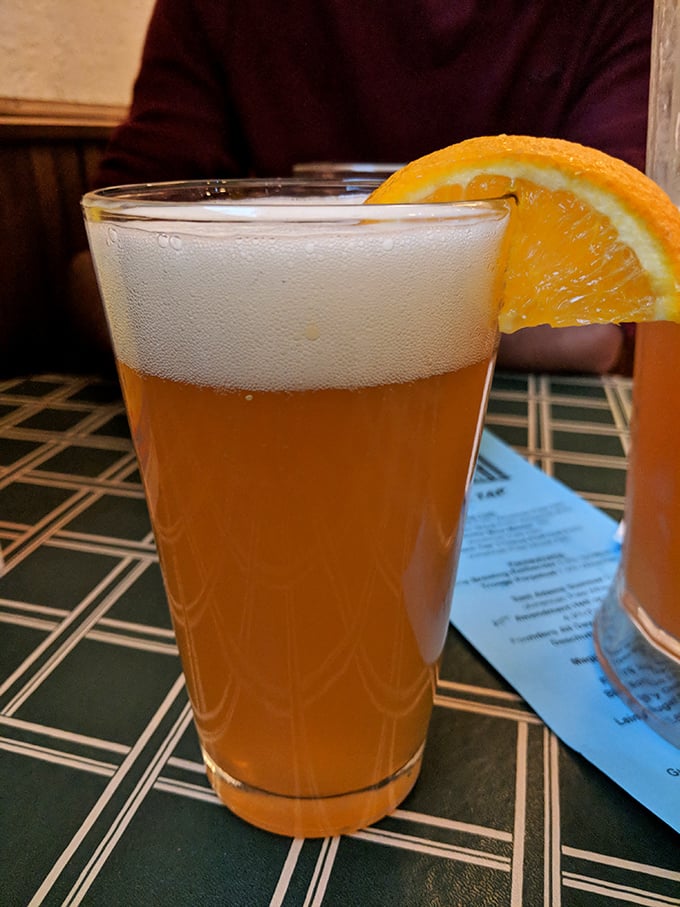 Blue Moon Belgian White garnished with orange – because even wing joints know how to elevate beer service.
