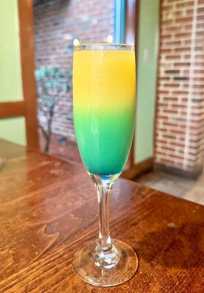 This isn't just a mimosa; it's a tropical vacation in a glass. The blue-to-yellow gradient makes drinking before noon feel downright artistic.